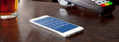 Placeit - Wide Mockup of an iPhone 6 on a Desert Counter