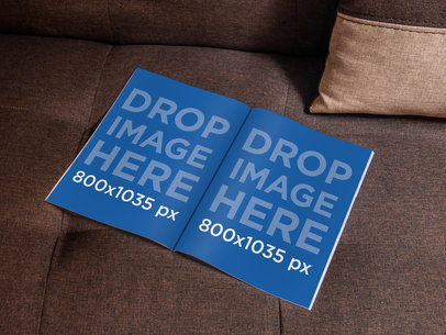 Placeit - Print Design Mockup, Magazine Centerfold Spread on a Brown Couch