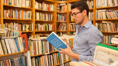 Placeit - Business Man Having a Coffee While Taking a Look at a Book ...