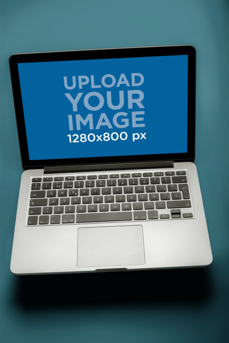 Placeit - Overhead View Mockup of a MacBook Pro on a Solid Surface