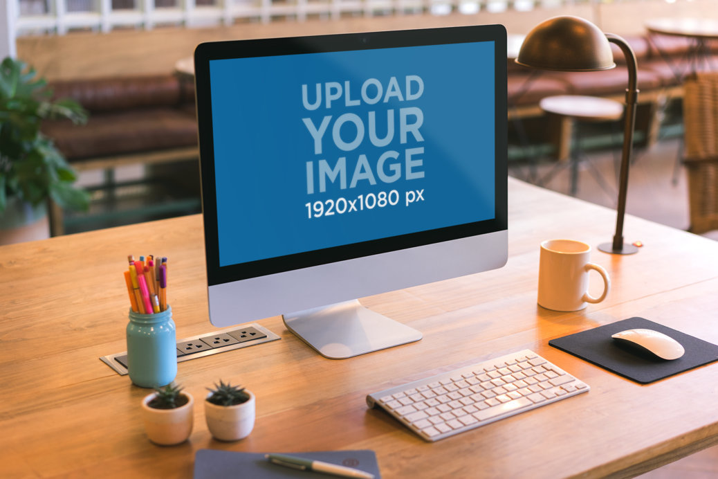 Placeit - Mockup Featuring an iMac Set Up on a Beautiful Wooden Desk