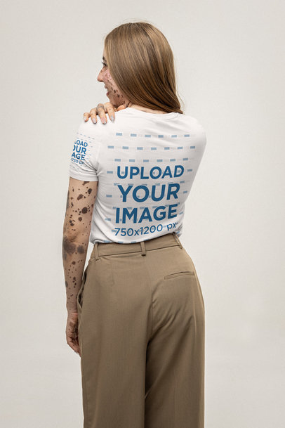 Placeit - Mockup of a Woman Showing The Back of a Bella Canvas Tee