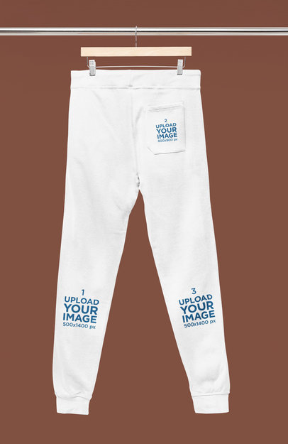 Placeit - Back-View Sweatpants Mockup Featuring a Hanger and a Colorful ...