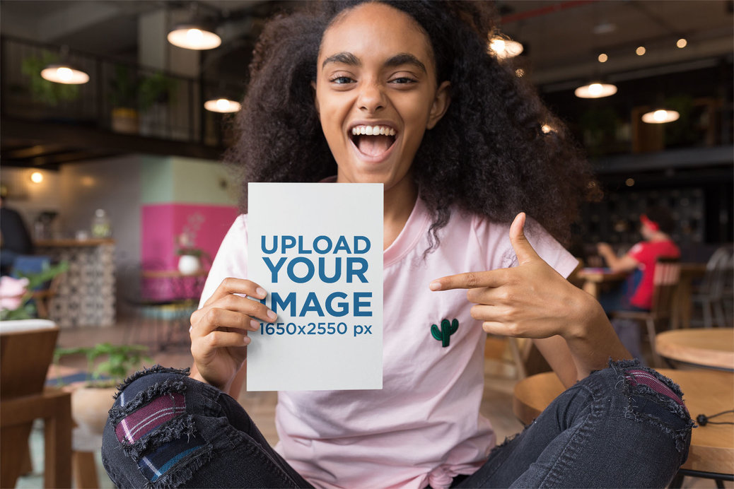 Placeit - Mockup of an Excited Woman Showing a Flyer