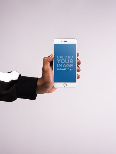 Placeit - Mockup of a Man Showing a Silver iPhone 8 Against a Bright ...