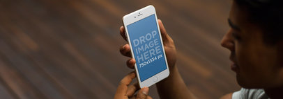 Placeit - Mockup Template of an iPhone 7 Against a Brick Wall