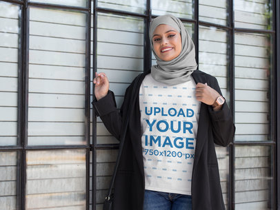 Placeit - T-Shirt Mockup of a Woman Wearing a Hijab and Standing Next ...