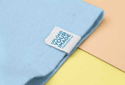 Placeit - Mockup of a Clothing Label Attached to a Shirt's Sleeve