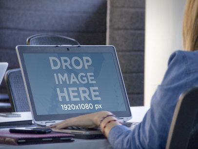 Placeit - Laptop Mockup of Business Woman Using Asus Zenbook at Work