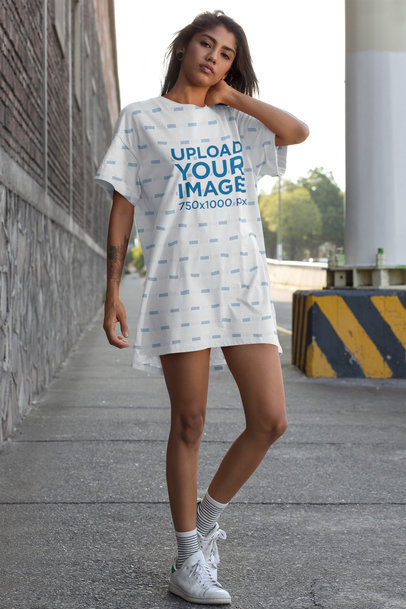 Placeit - Shift Dress Mockup of a Young Woman Posing in Front of a ...