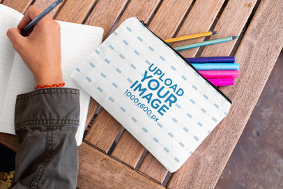 Placeit - Mockup of a Woman Writing in a Spiral Notebook