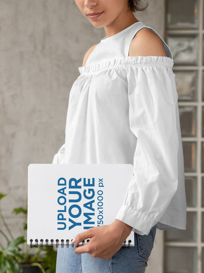 Placeit - Spiral Notebook Mockup of a Woman Working on Her Desk