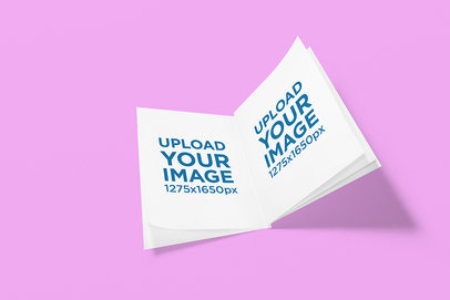 Placeit - Open Booklet on a Yellow Surface Mockup