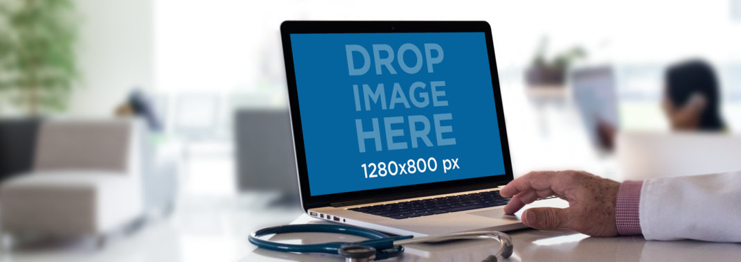 Placeit - MacBook Mockup of a Senior Doctor at a Hospital