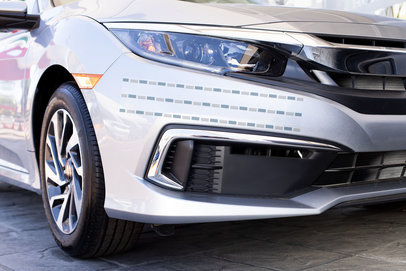 Placeit - Mockup of a Sticker on a Car Back Bumper