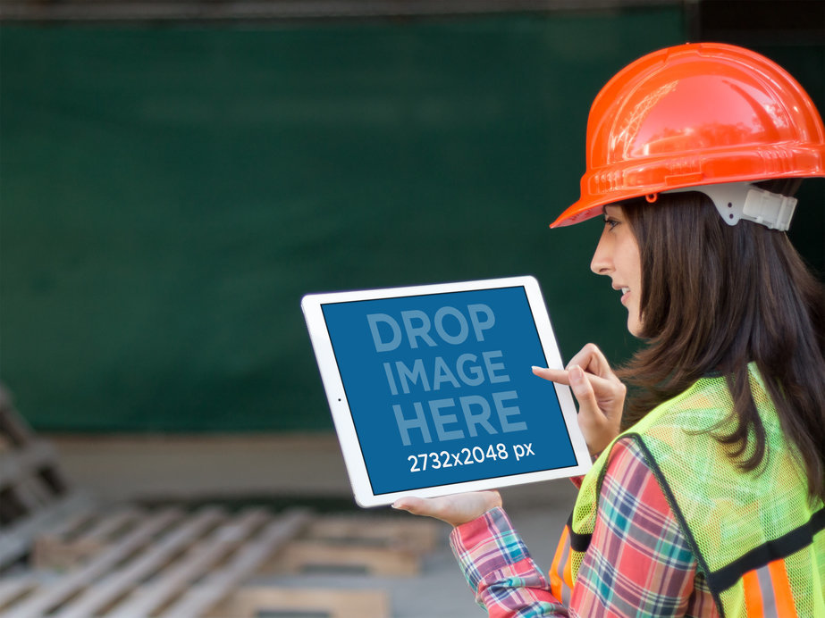 Placeit - iPad Mockup in Landscape Position of a Female Worker Outside ...