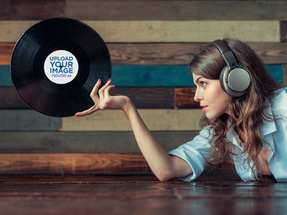Placeit - Mockup of a Woman Posing with a Vinyl Record