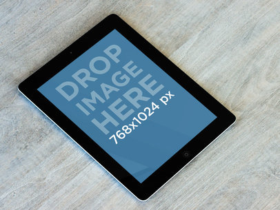 Placeit - Mockup of a Black iPad on a Grey Table