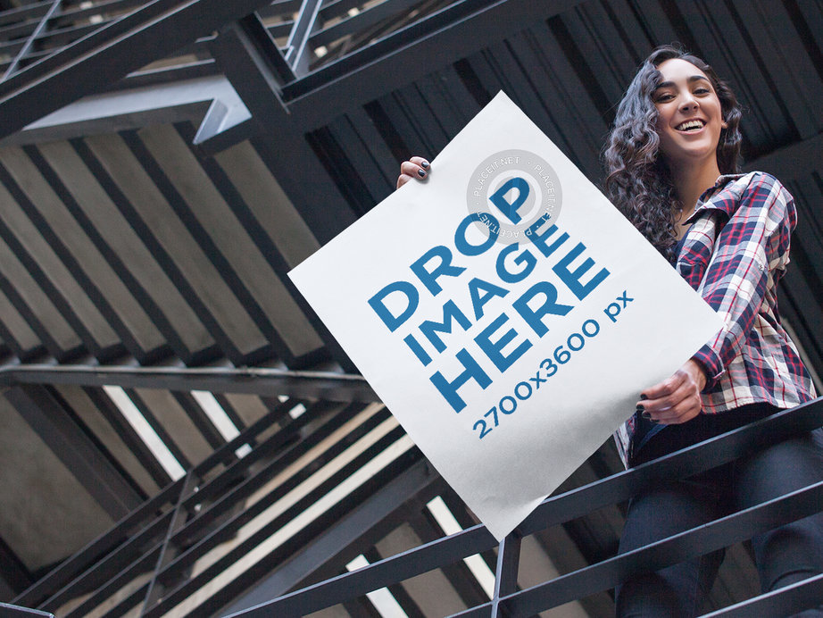 Placeit - Young Woman Showing a Big Poster From Above Mockup