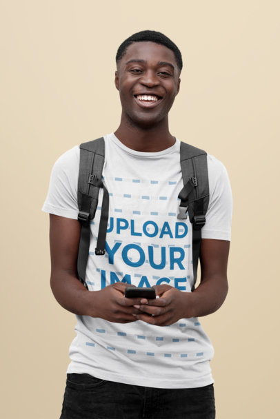 Placeit - T-Shirt Mockup of a Happy College Student at a Studio