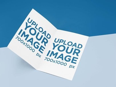 Placeit - Floating Open Booklet Mockup Against a Bicolor Background
