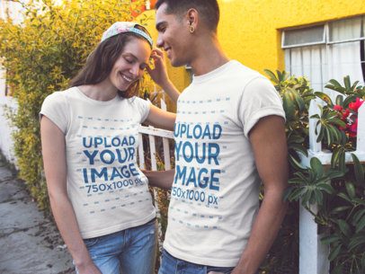Placeit - Smiling Interracial Couple Wearing T-Shirts Mockup at the Office