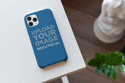 Placeit - Mockup of a Phone Case Placed in an Elegant Work Setting