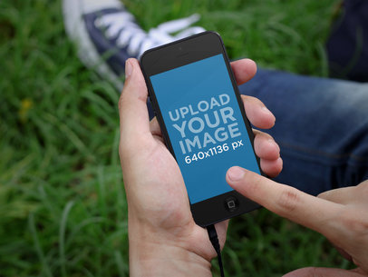Placeit - Mockup of Someone Using an iPhone 5
