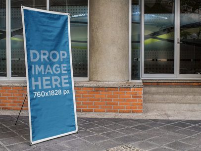 Placeit - Mockup of a Vertical Building on the Front Wall of a Building