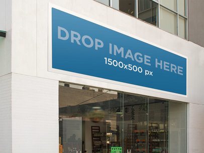 Placeit - Horizontal Banner Mockup Outside a Store at a Mall