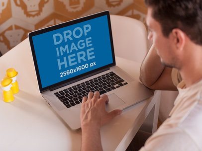 Placeit - Corporate Man Working on a MacBook Mockup